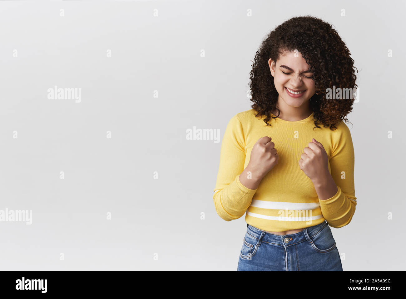 Girl rejoicing cheering achieving prize close eyes yelling yes clench ...