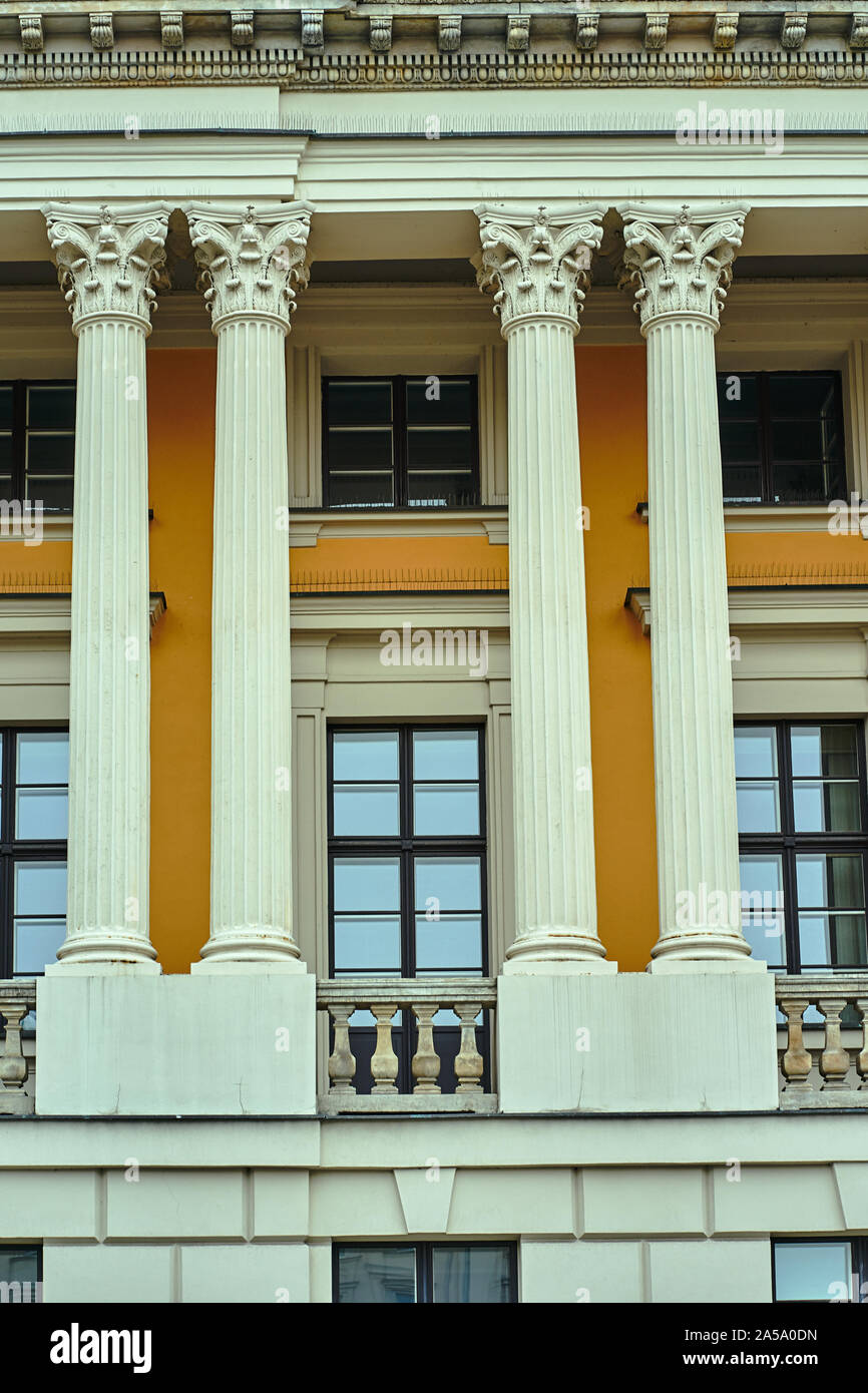 A fragment of the facade of a historic building with Corinthian columns in Poznan Stock Photo ...