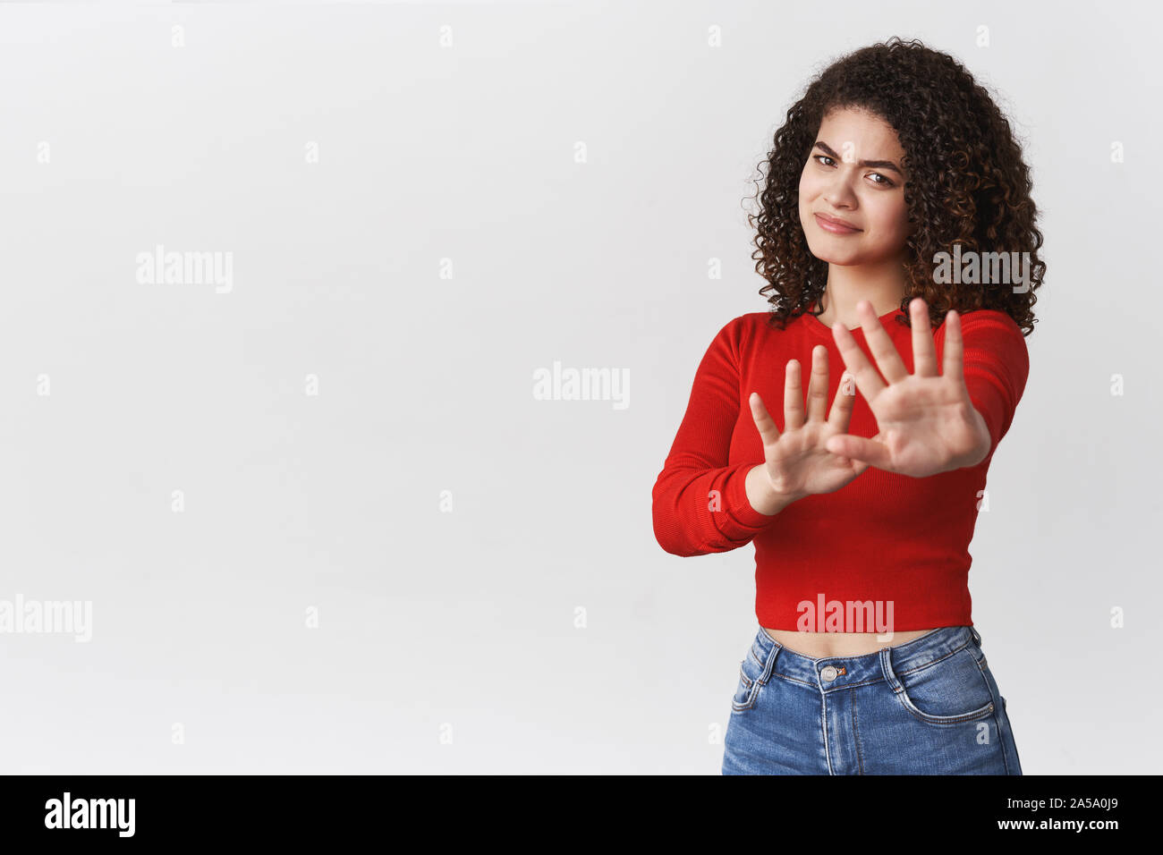 No thanks. Reluctant awkward displeased young stylish girl curly dark ...