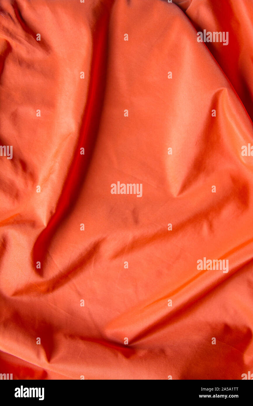 Soft Orange satin background texture close up view Stock Photo - Alamy