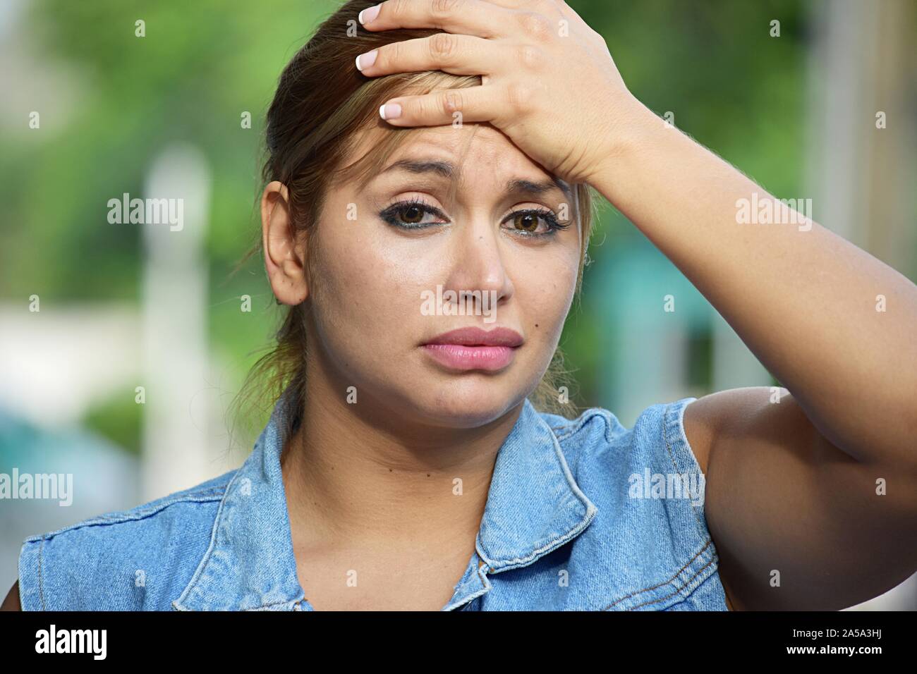 Worrisome Young Woman Stock Photo - Alamy