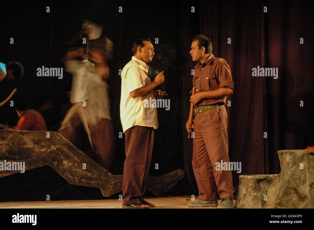 Artists perform at the play 'Somoyer Proyojone' at Mahila Samiti ...
