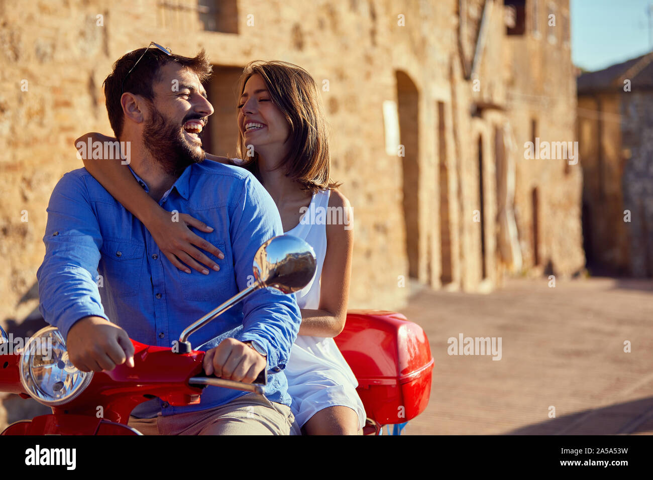 Couple riding motor scooter in hi-res stock photography and images - Alamy