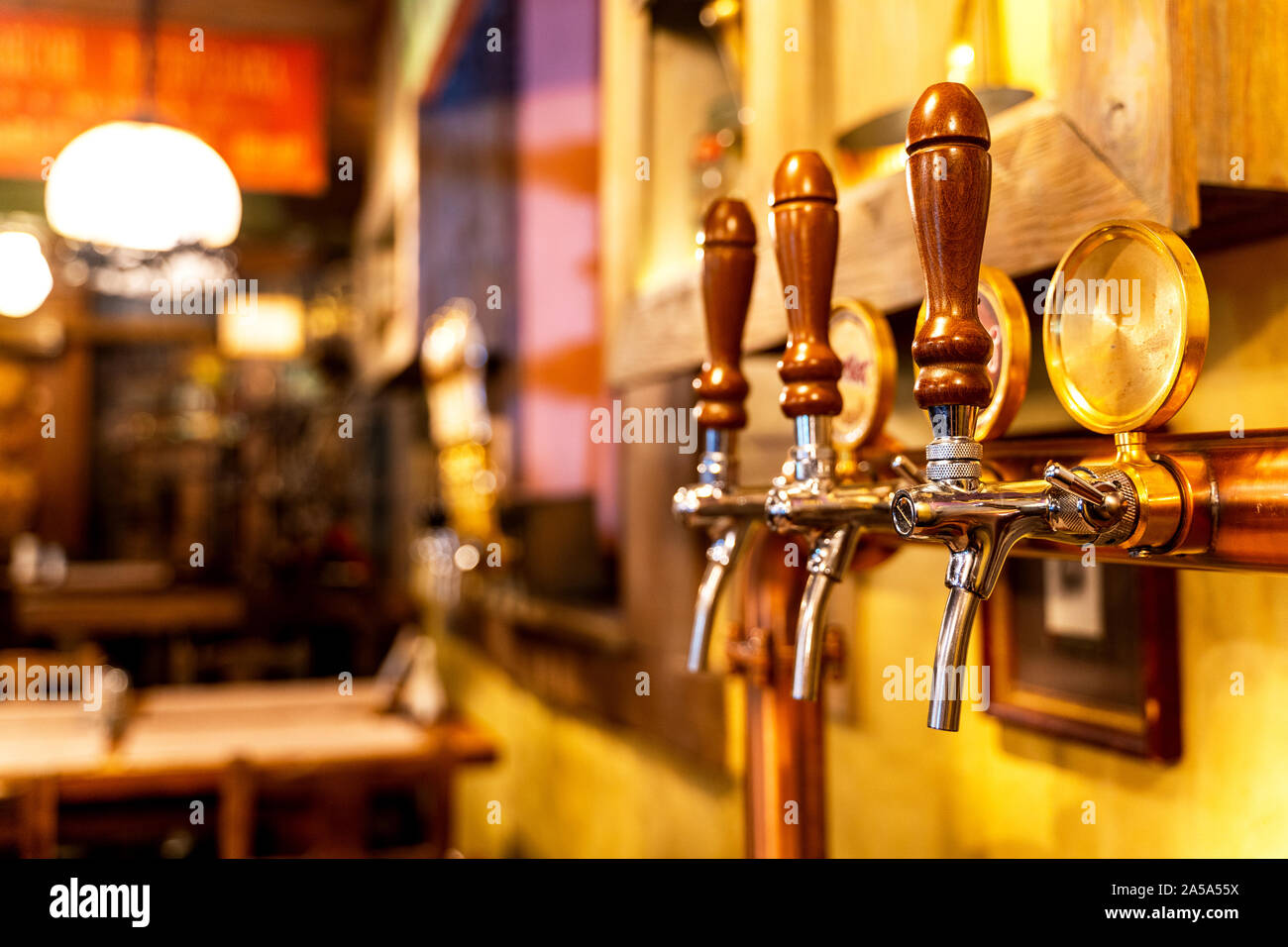 Beer tabs are put on a wall as decoration in a bar environment Stock ...
