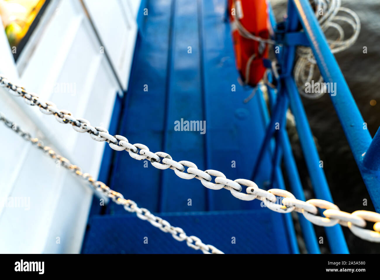White painted chains are used to block the way as a security measure on ...