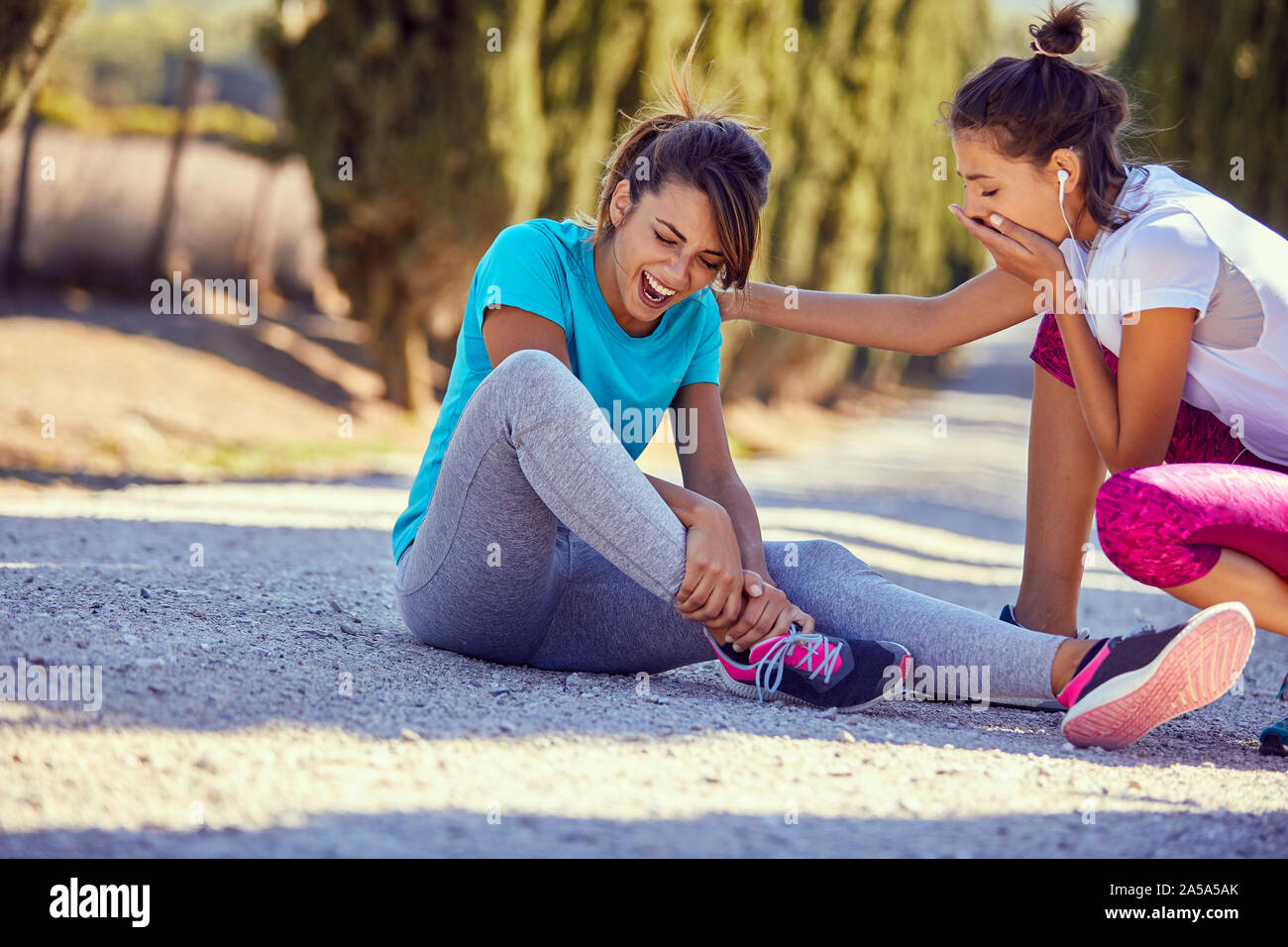 sport injury. Young girl injury at jogging Stock Photo - Alamy