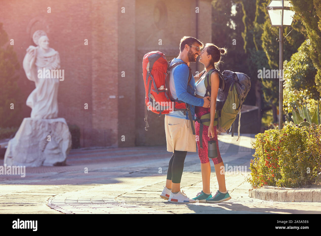Travel. Young Tourist Couple Traveling, Walking at city Stock Photo - Alamy