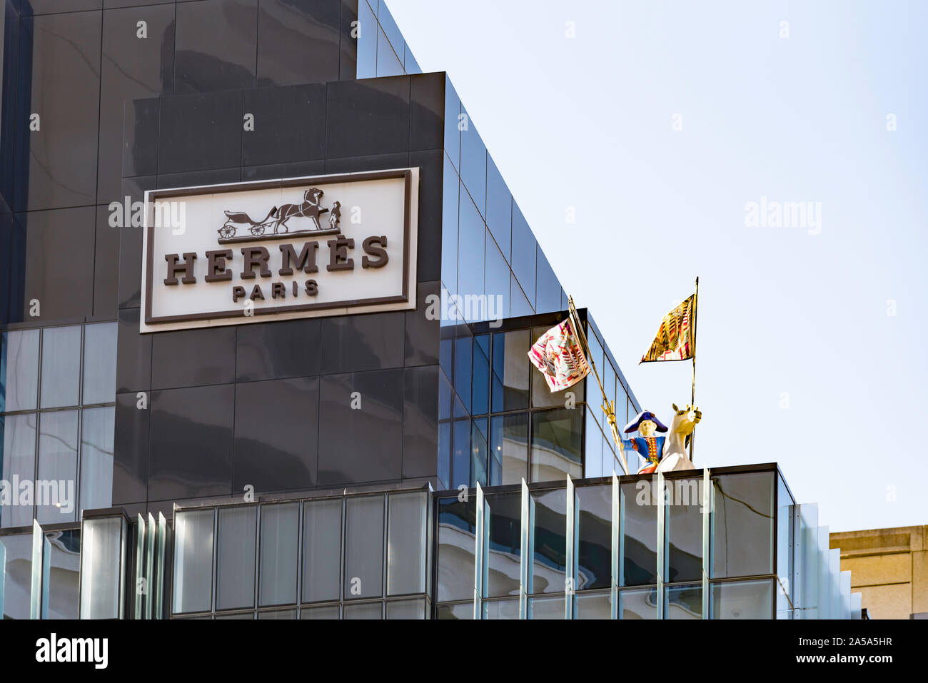 The corporate logo for Hermes of Paris, the multinational high fashion ...
