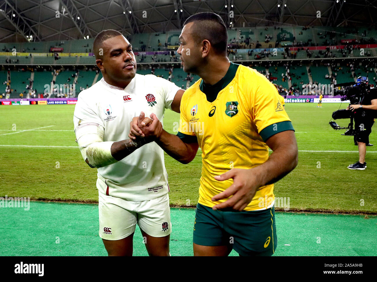 England's Kyle Sinckler (left) shakes hands with Australia's Kurtley ...