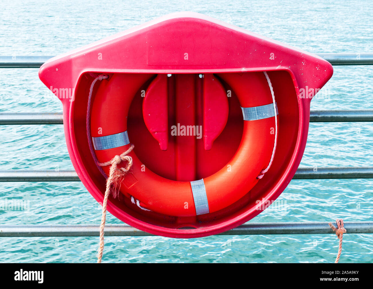 Red life preserver on display Stock Photo - Alamy