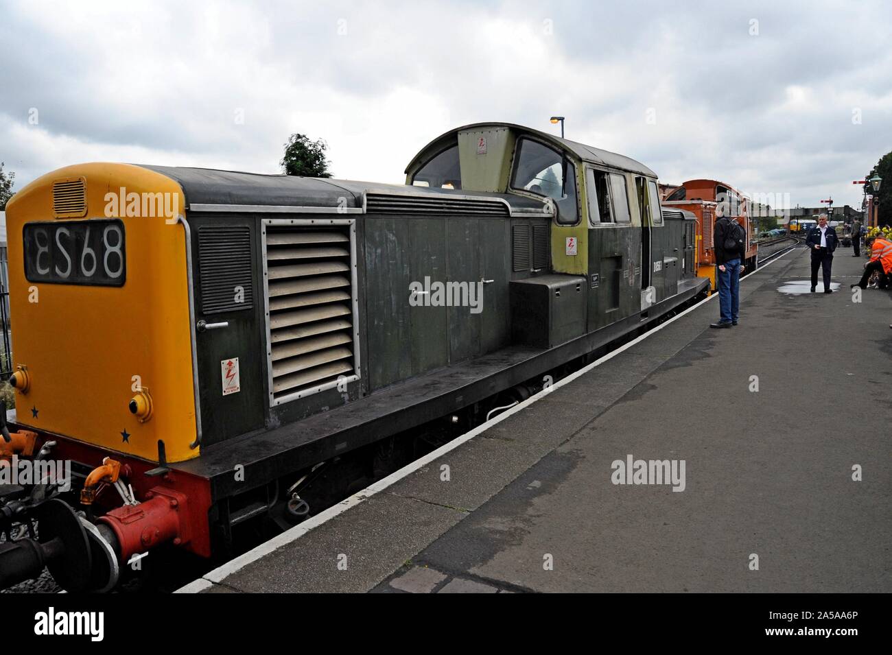 Rail enthusiasts watch a British Rail class 17 diesel locomotive as it ...