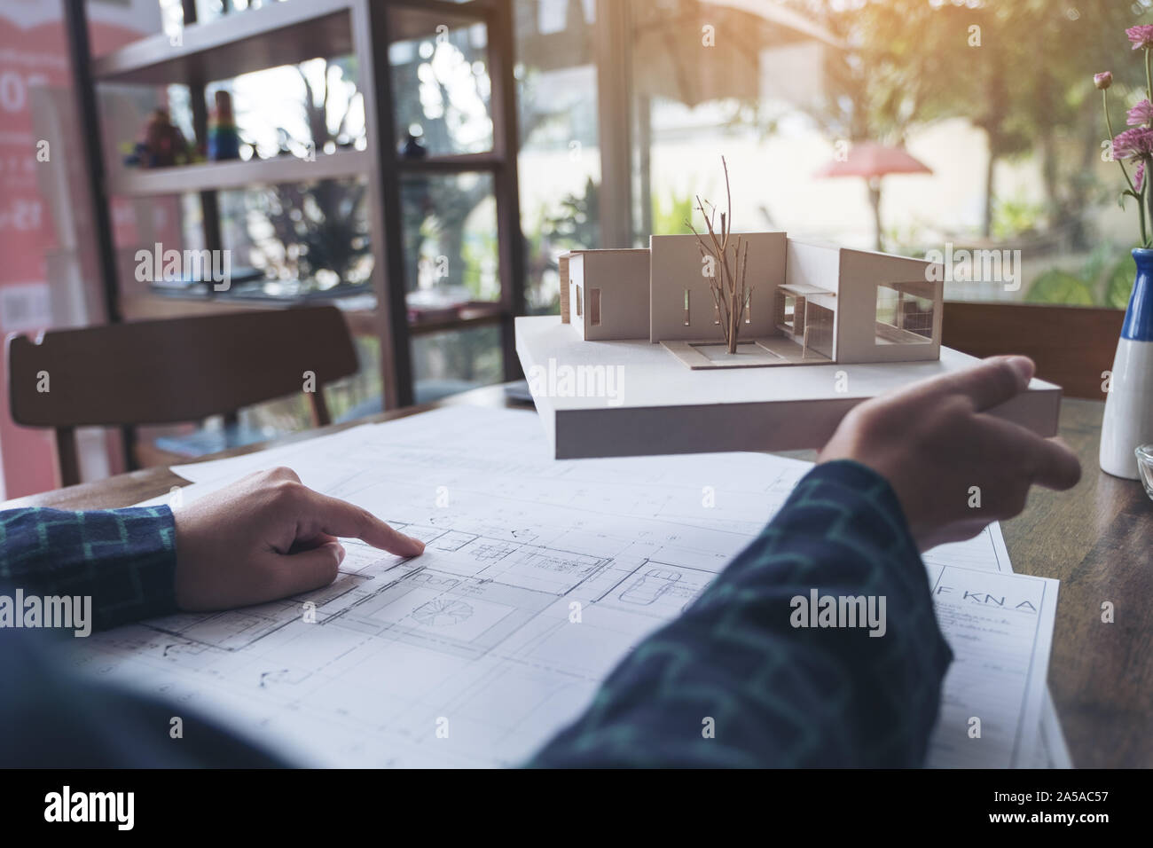 Architect pointing house model hi-res stock photography and images - Alamy
