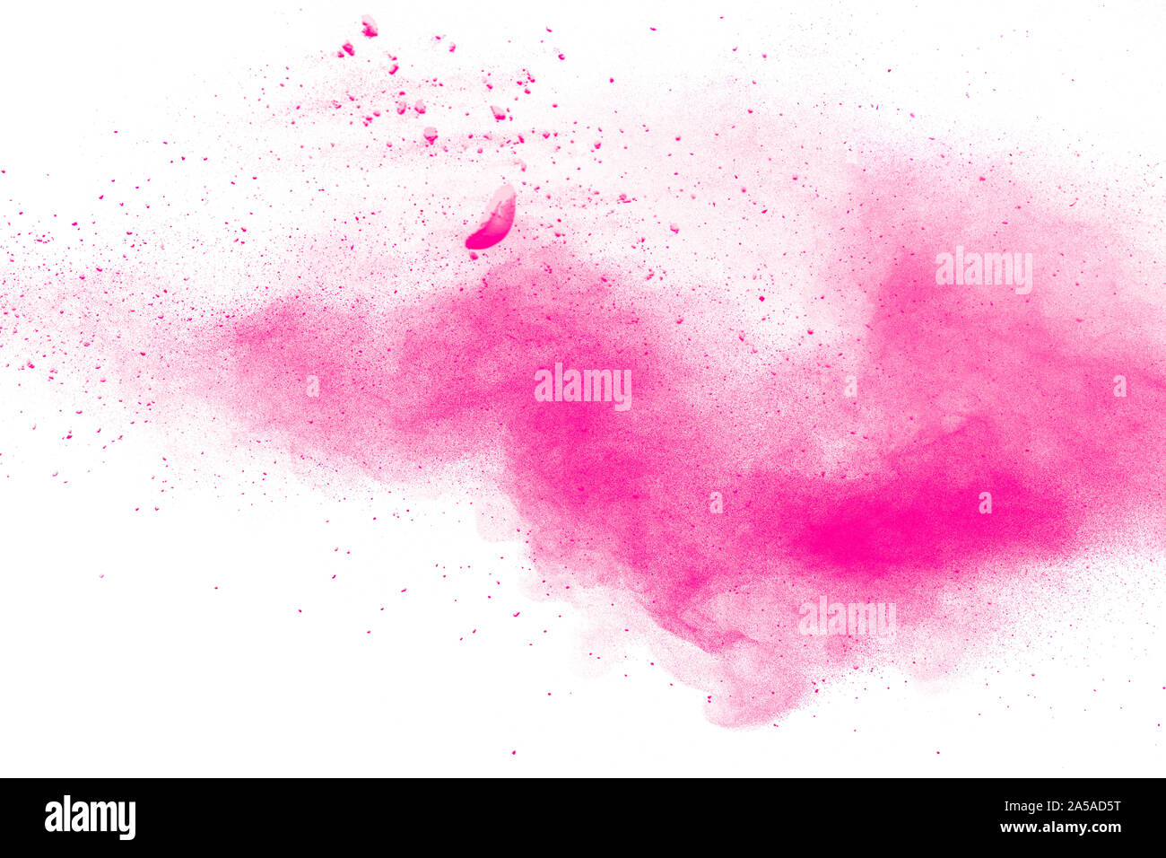 Abstract pink dust explosion on white background. Freeze motion of pink ...