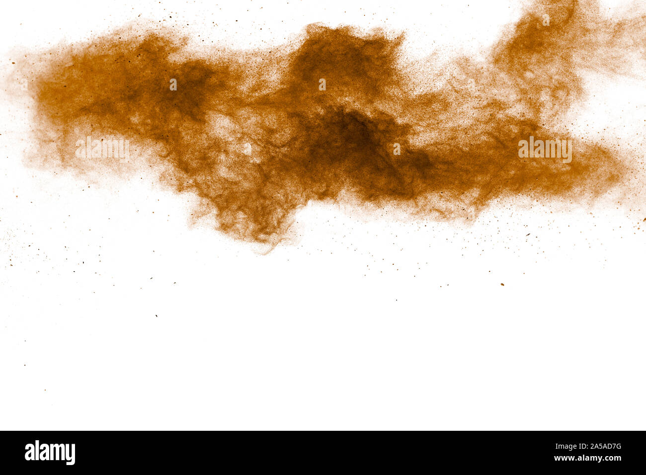 Abstract deep brown dust explosion on white background.Freeze motion of ...