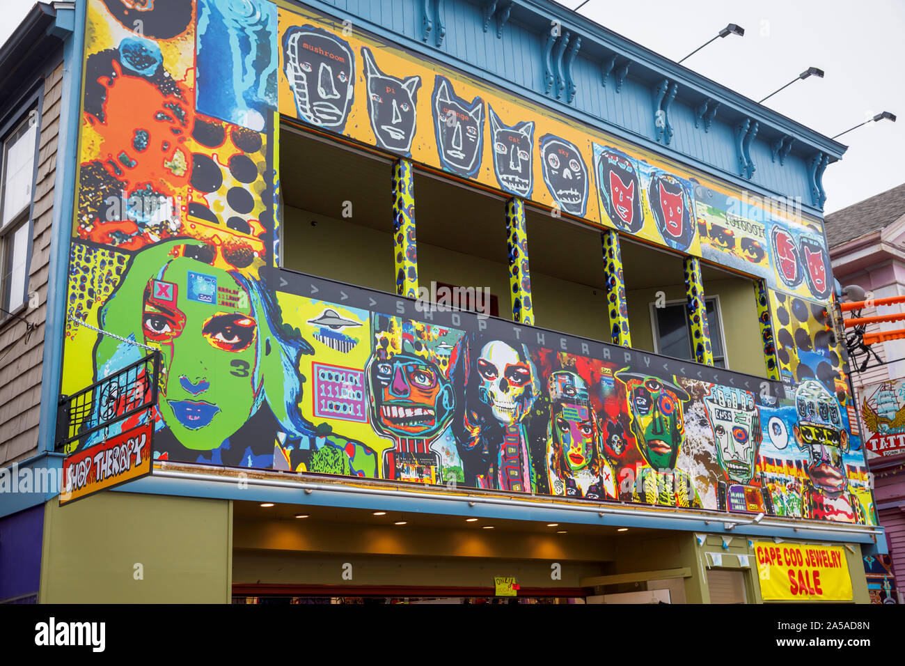 Colourful shopfront with unusual bizarre faces on a shop in Commercial ...