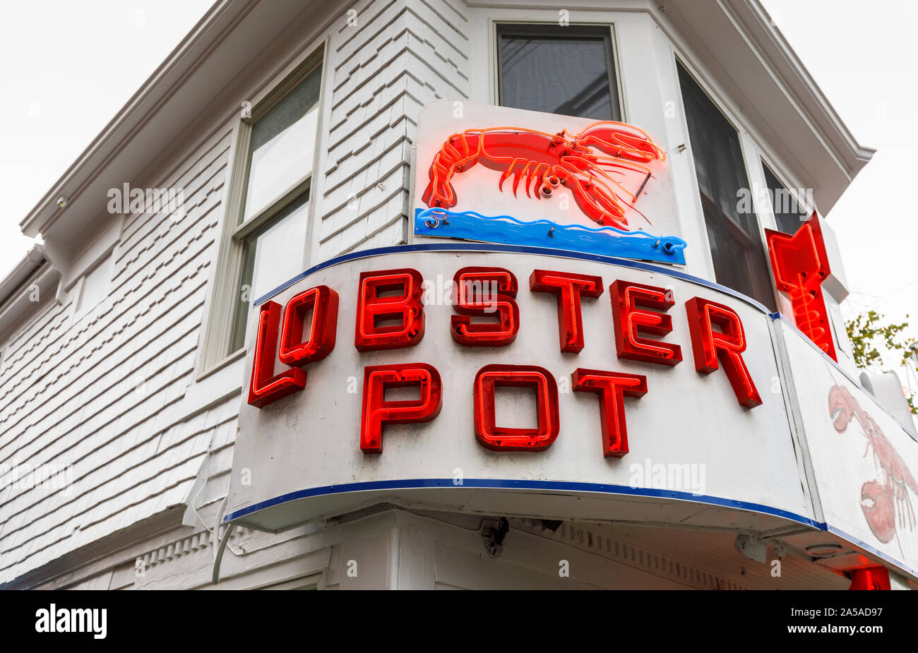 Cedar shingled frontage and illuminated neon name signs of local ...