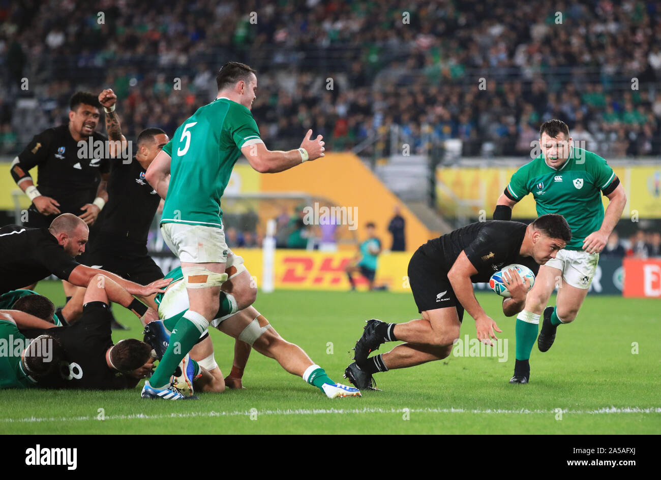 New Zealand's Codie Taylor (second right) runs in to score his side's ...