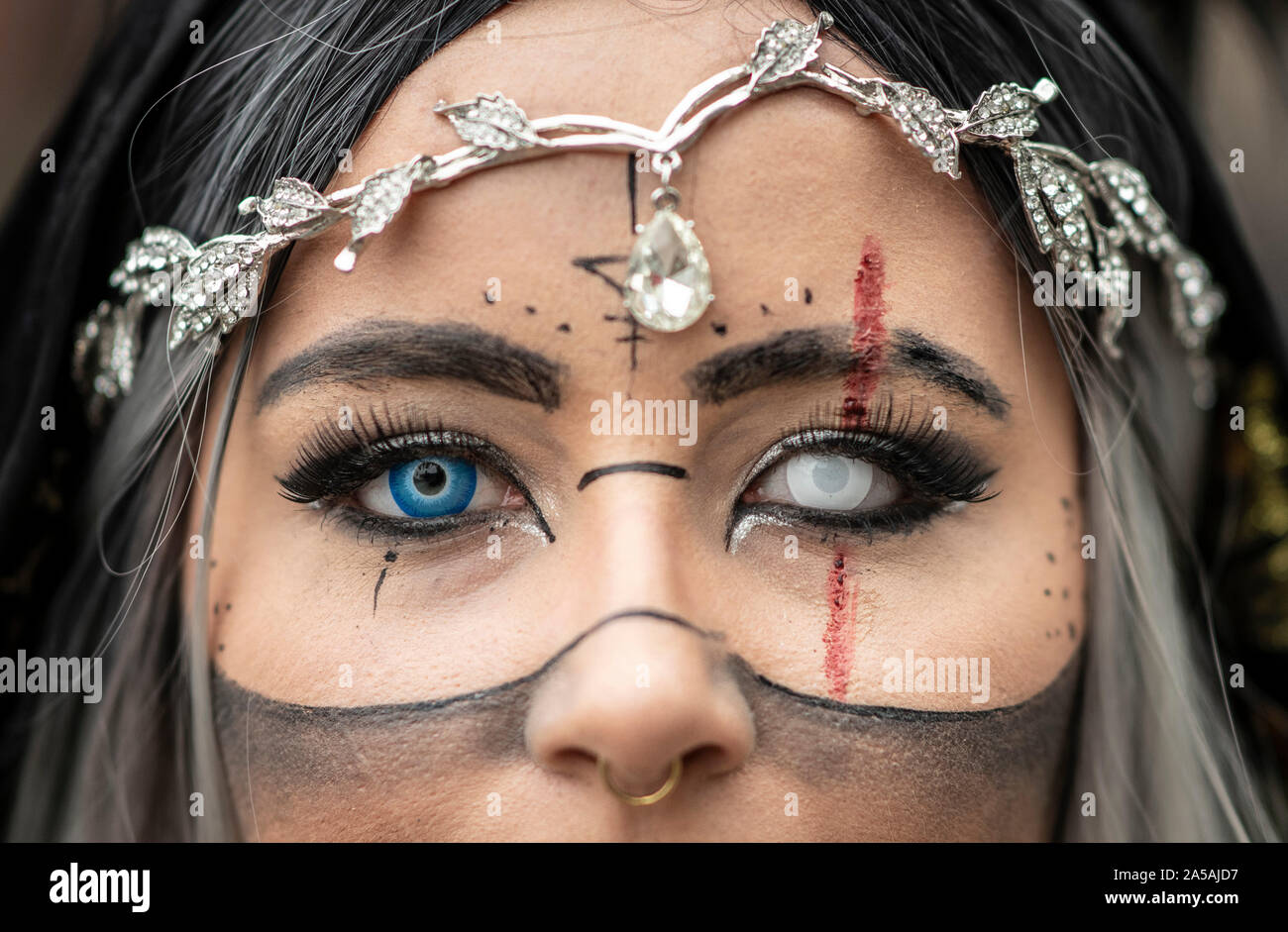 Frankfurt, Germany. 19th Oct, 2019. A cosplayer walks through the ...