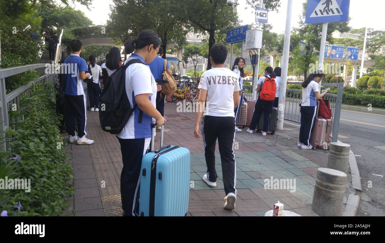 Shenzhen, China: boarding high school students waiting for school bus ...