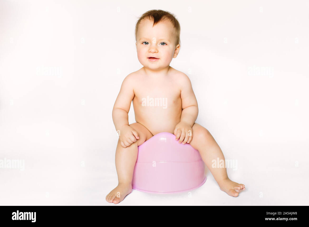 Pretty baby and pink potty . Isolate on white Stock Photo - Alamy