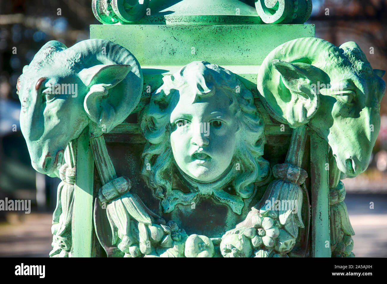 A decorative metal cherub and rams statue outside the breakers mansion ...