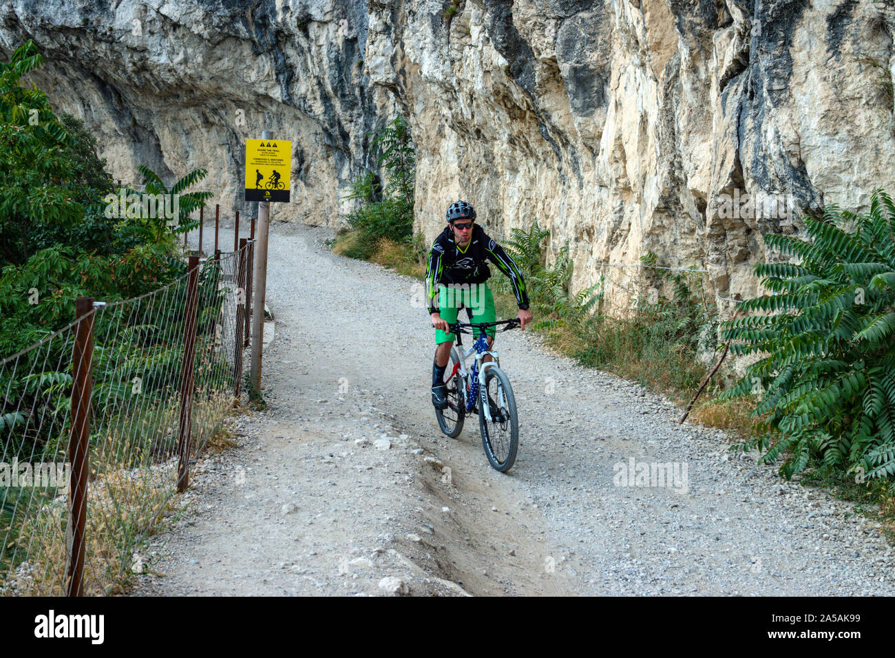 Yellow and black Signs on Old Ponal Road, Riva del Garda, on Lake Garda ...