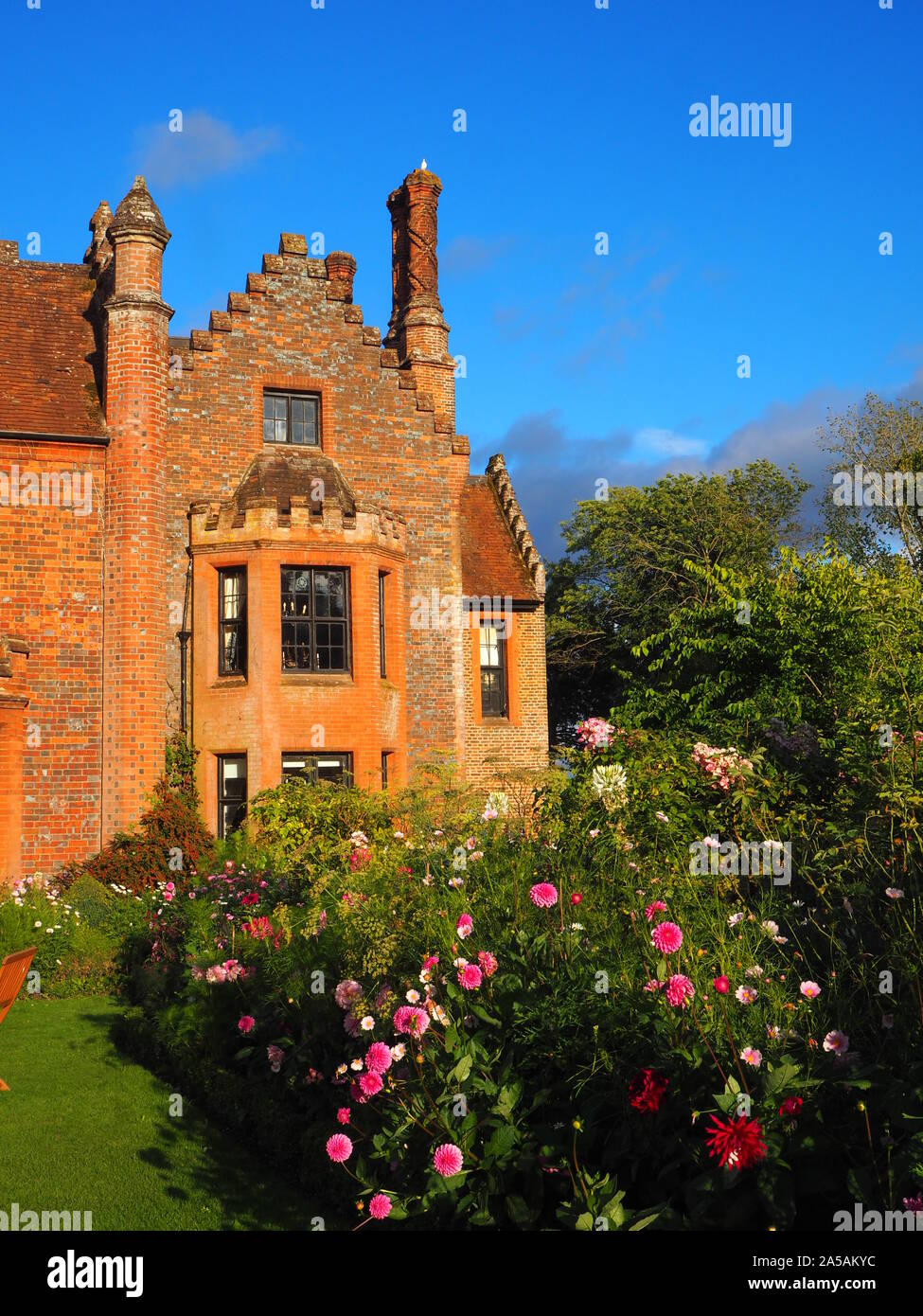 Portrait of Chenies Manor House from garden.Fine weather, blue sky and ...