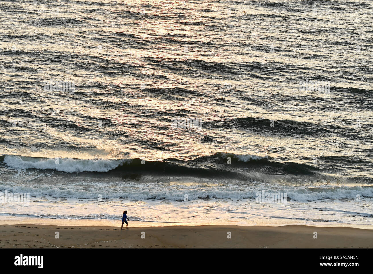 Female early morning walk on beach Stock Photo - Alamy