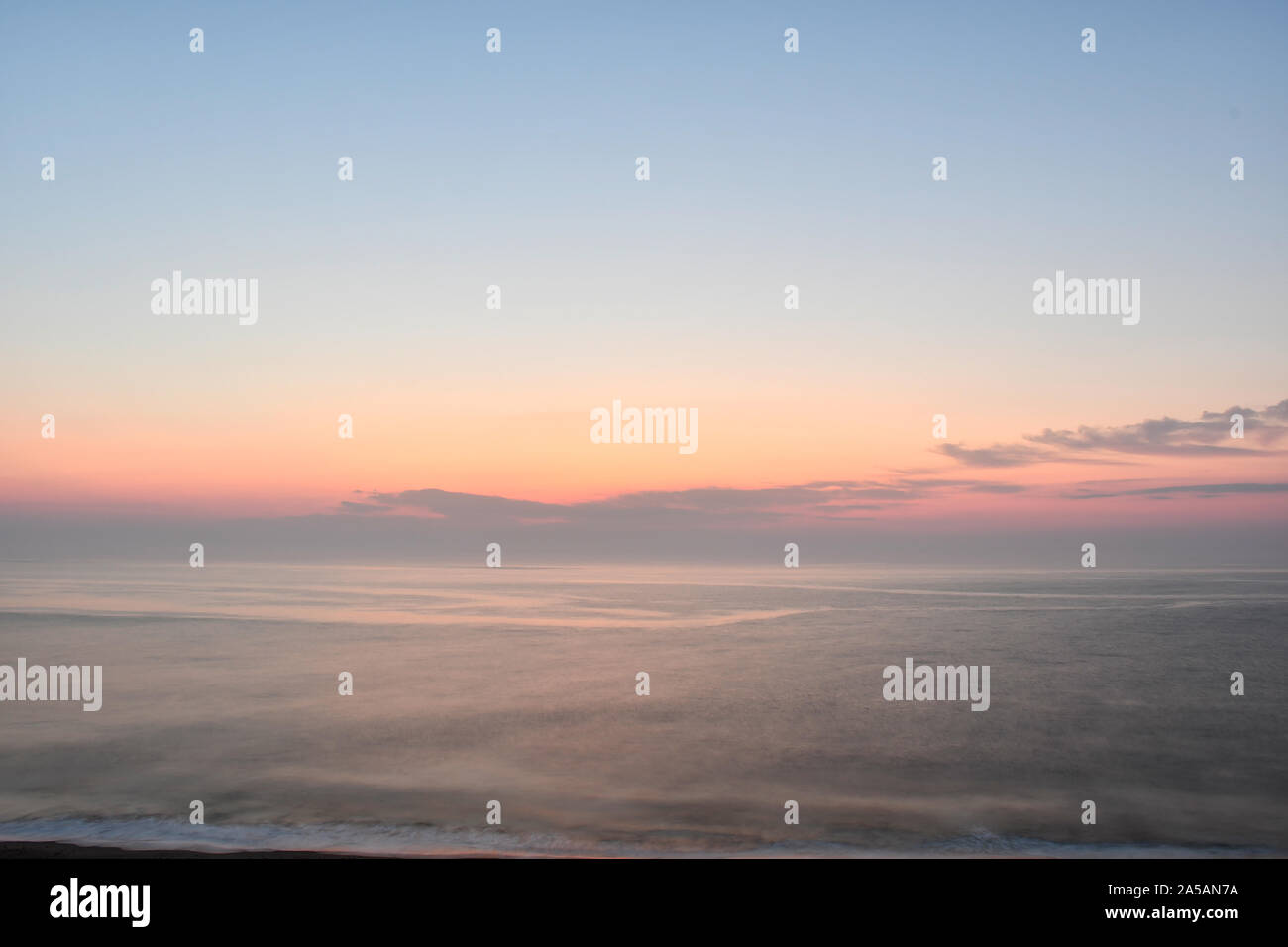sunrise over Atlantic Ocean clouds partially blocking sun Stock Photo ...