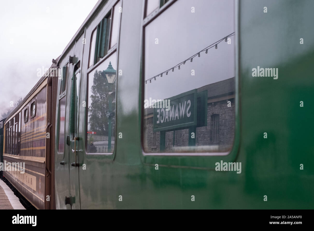 Vintage steam train on the platform at Swanage railway station. The ...