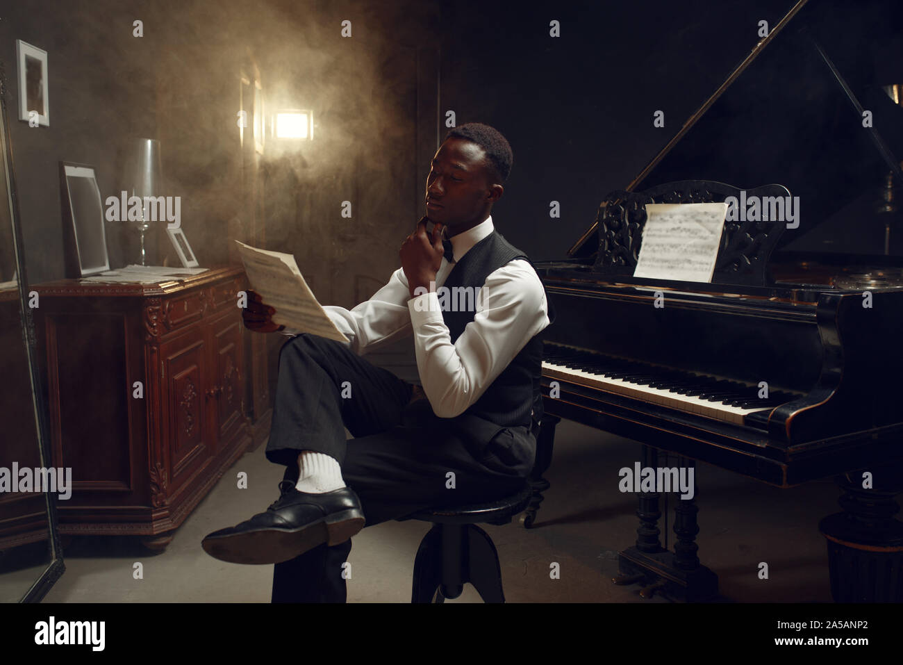 Stylish black grand piano player, jazz performance Stock Photo - Alamy