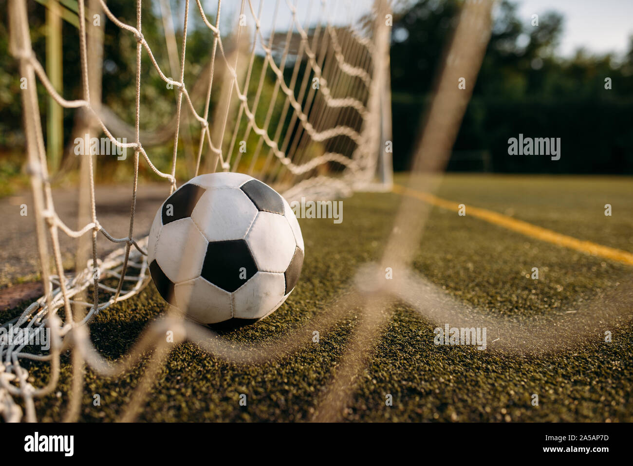Soccer ball in the gate net, nobody Stock Photo - Alamy