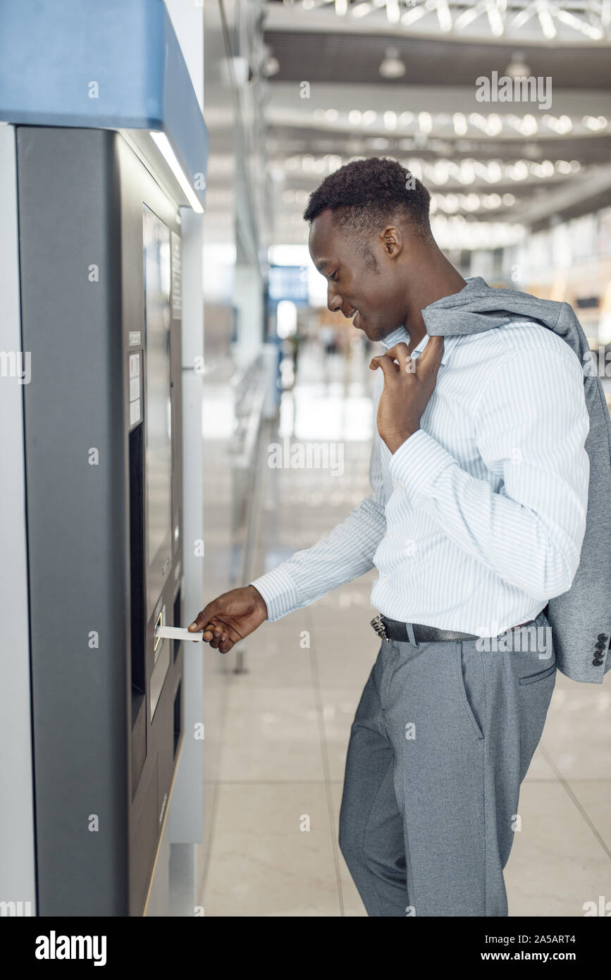 Businessman at coffee machine in car dealership Stock Photo - Alamy