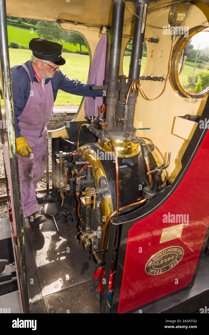 Engine driver at the controls of Maid Marian a narrow gauge steam ...
