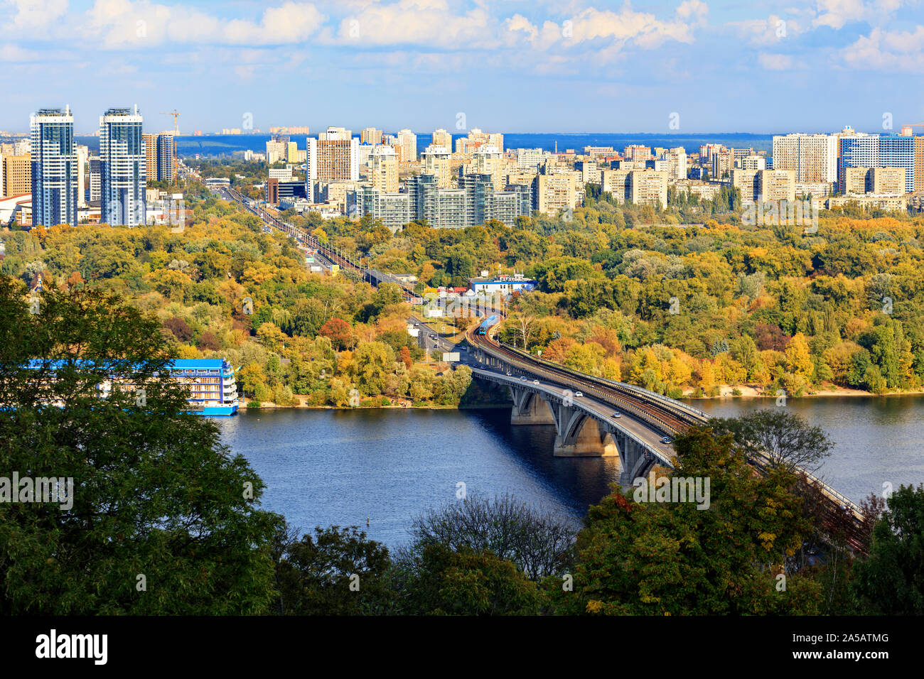 Landscape of the autumn city of Kyiv with a view of the Dnipro River, a ...