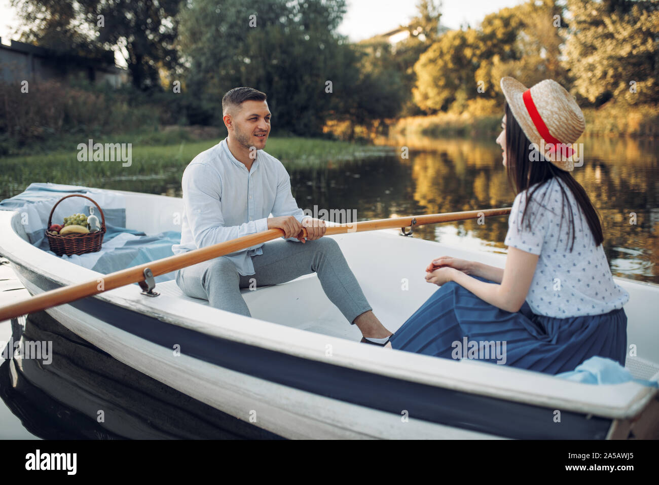 Love couple boating on lake, romantic meeting Stock Photo - Alamy