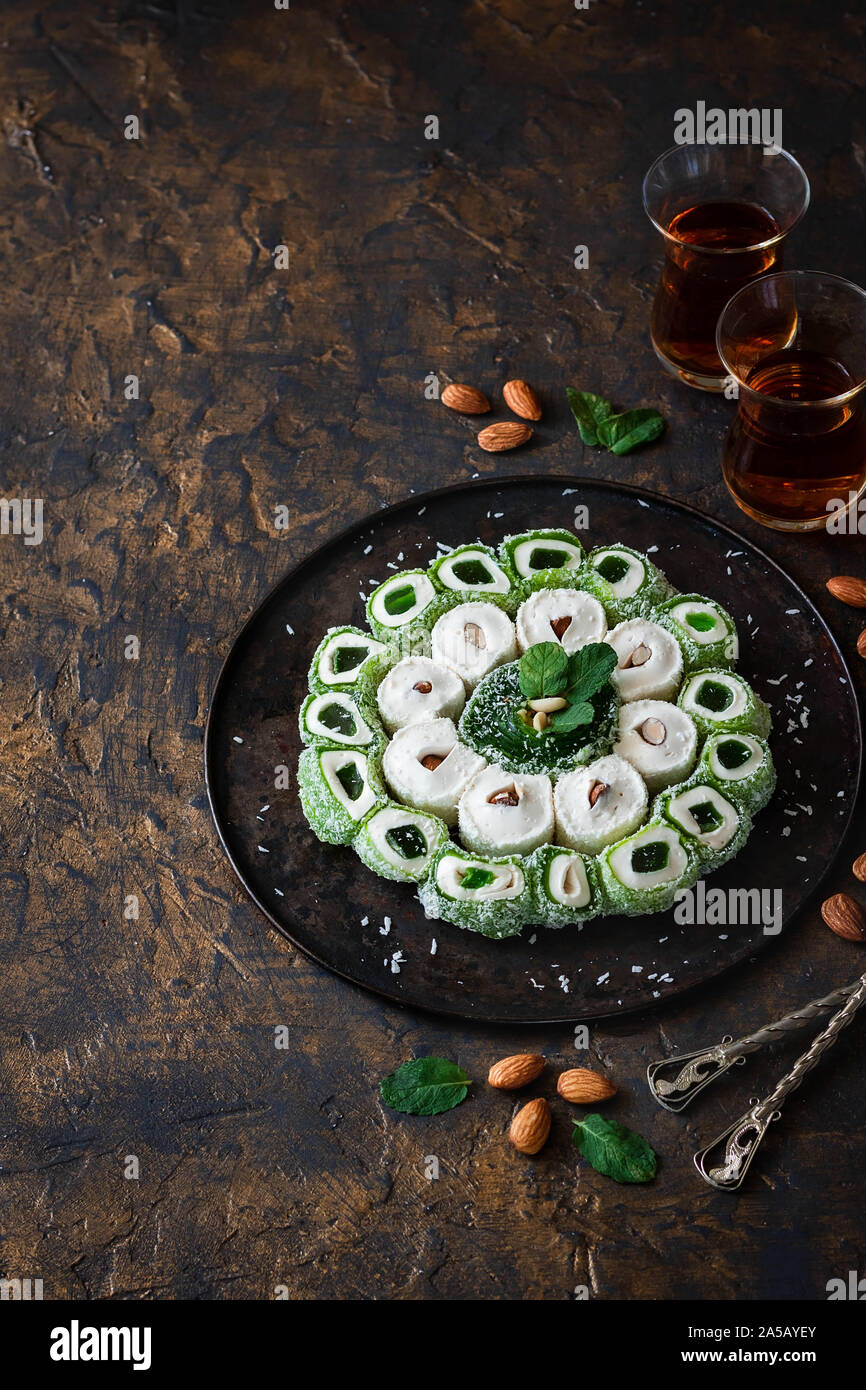Turkish Delight. Assorted multi-colored oriental sweets with almonds on ...