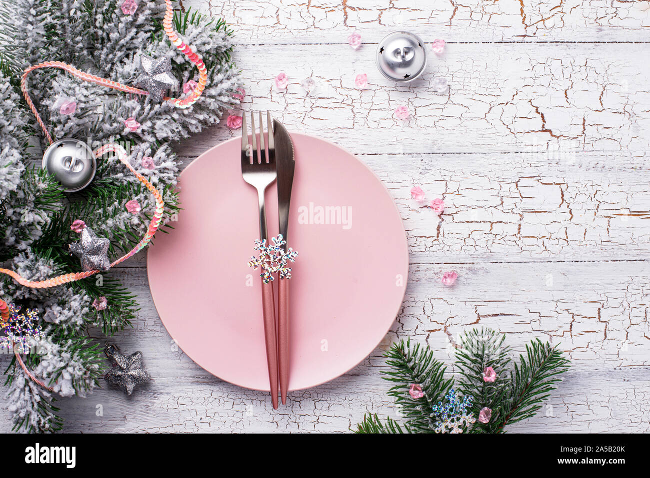 Christmas table setting in pink color Stock Photo - Alamy