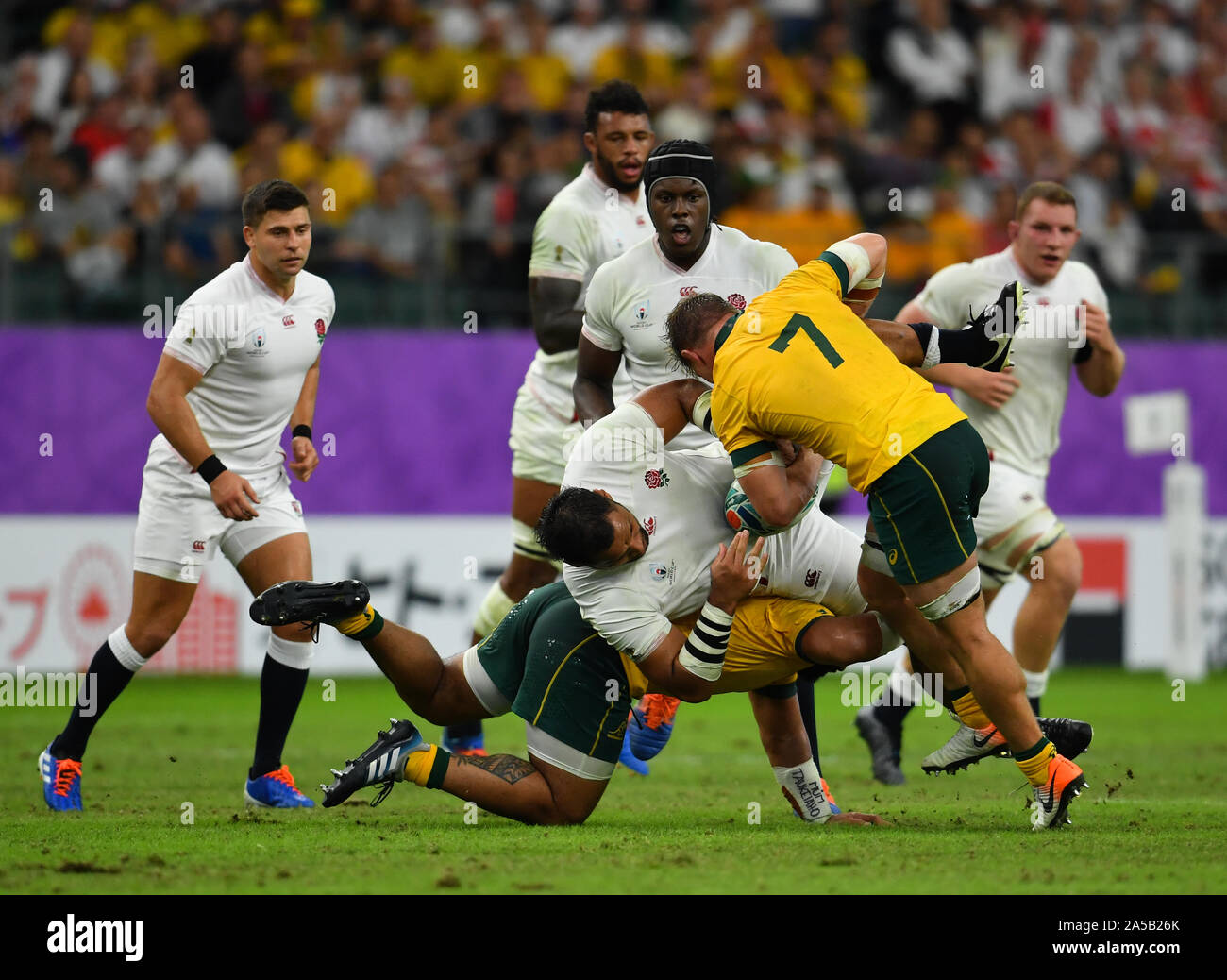 England's Billy Vunipola is tackled by Australia's Michael Hooper ...