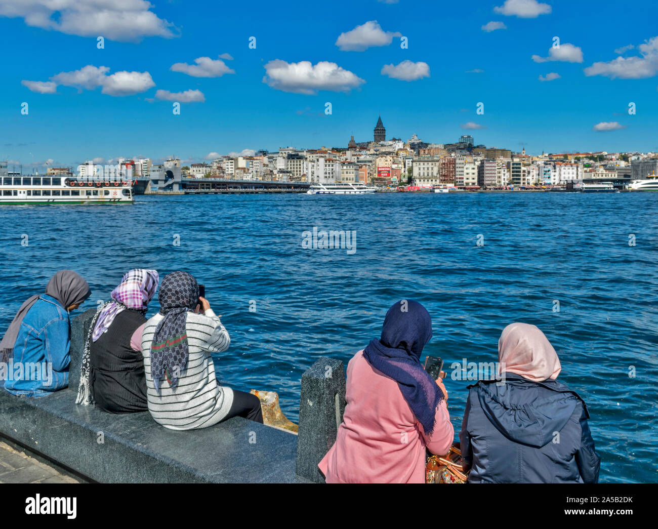 ISTANBUL TURKEY THE KARAKOY SKYLINE PEOPLE ENJOYING THE VIEW ACROSS THE ...
