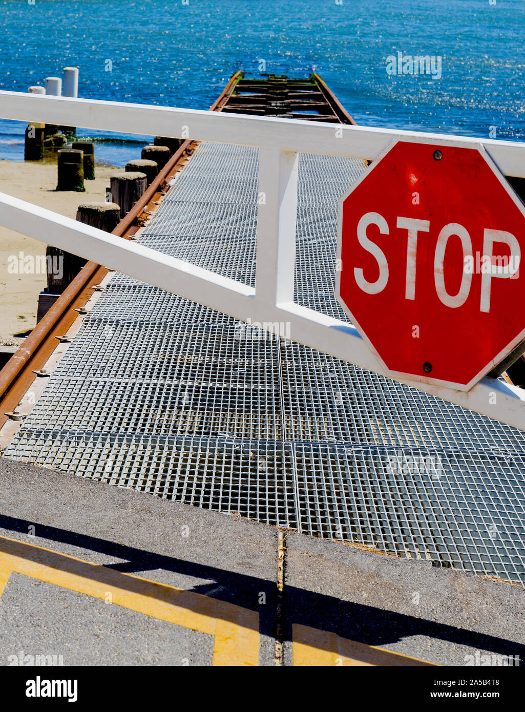 Closed barrier with Stop sign by beach Stock Photo - Alamy
