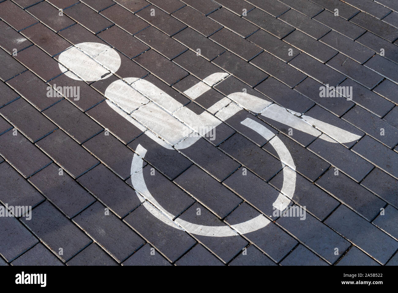 Disabled Person Wheelchair Sign Traffic Symbol On Brick Stone Pavement ...