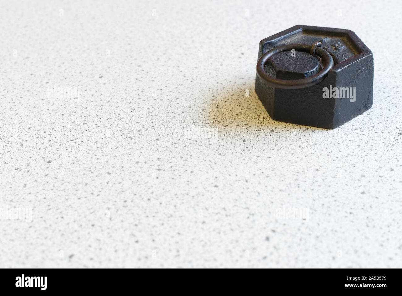 1kg mass on a desk top in a science lab. Science education concept ...