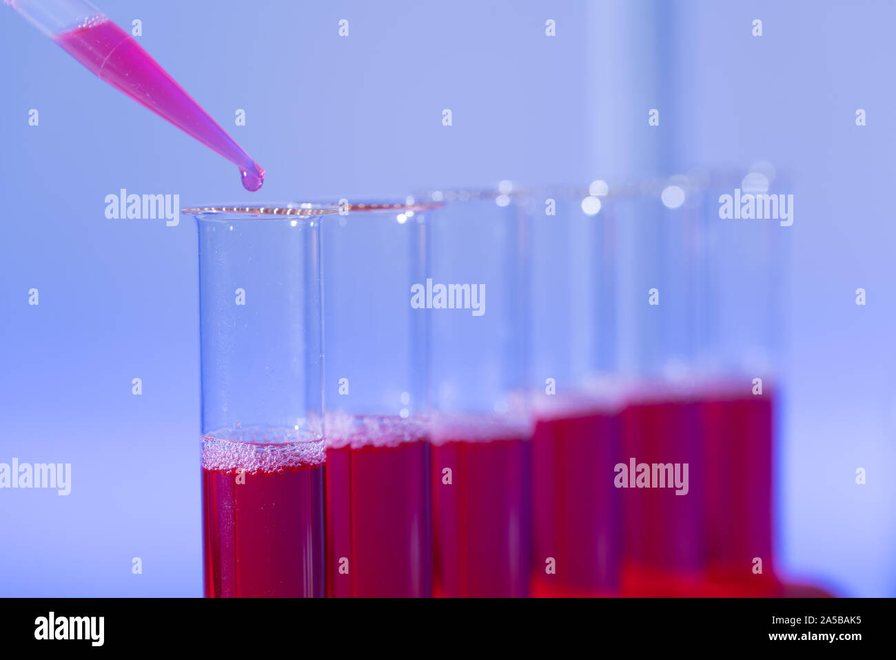 Test tube in rack and pipette media dispenser Stock Photo - Alamy