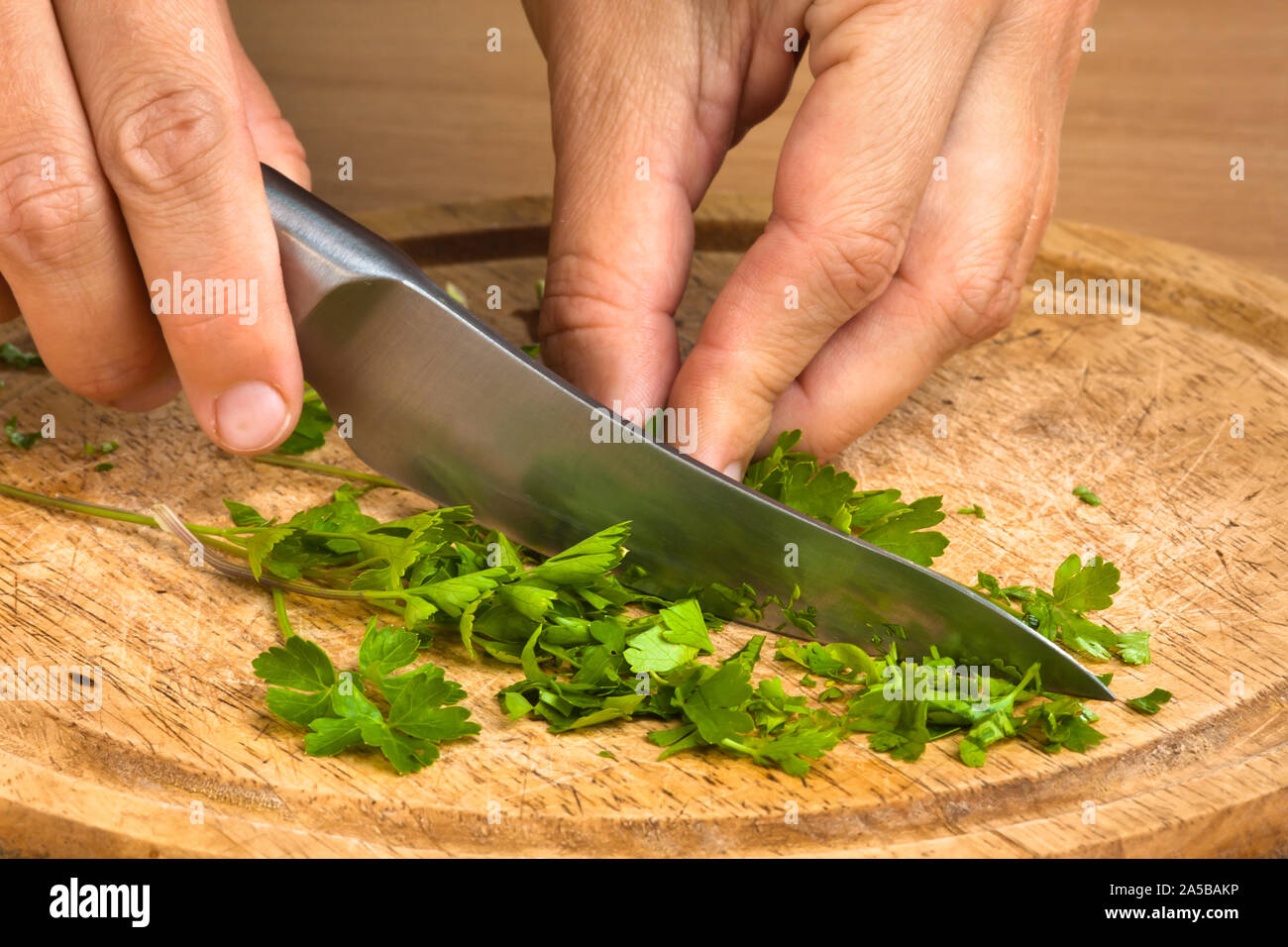 Organic woman chopping leaves hi-res stock photography and images - Alamy