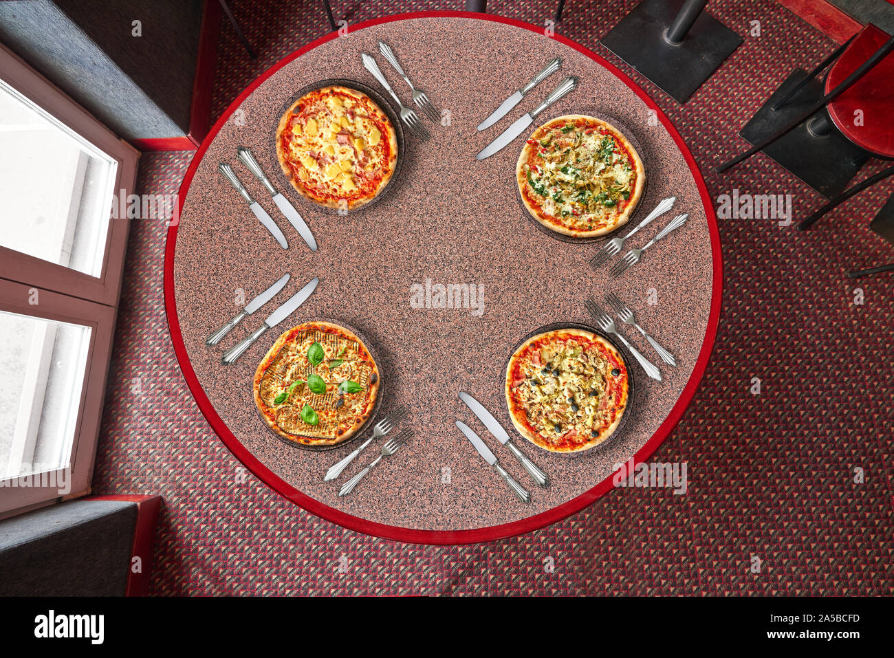 Round textured table view from above and four pizza on plate Stock ...