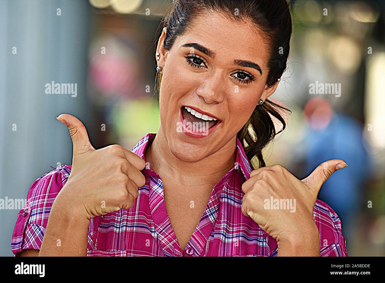 Happy Colombian Woman Wearing Pink Shirt Stock Photo - Alamy