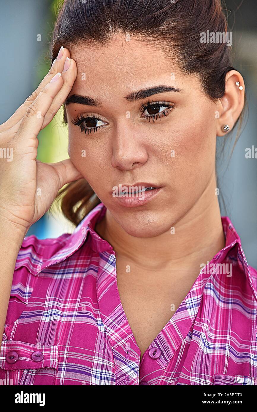 Hispanic Adult Female Under Stress Wearing Pink Shirt Stock Photo - Alamy