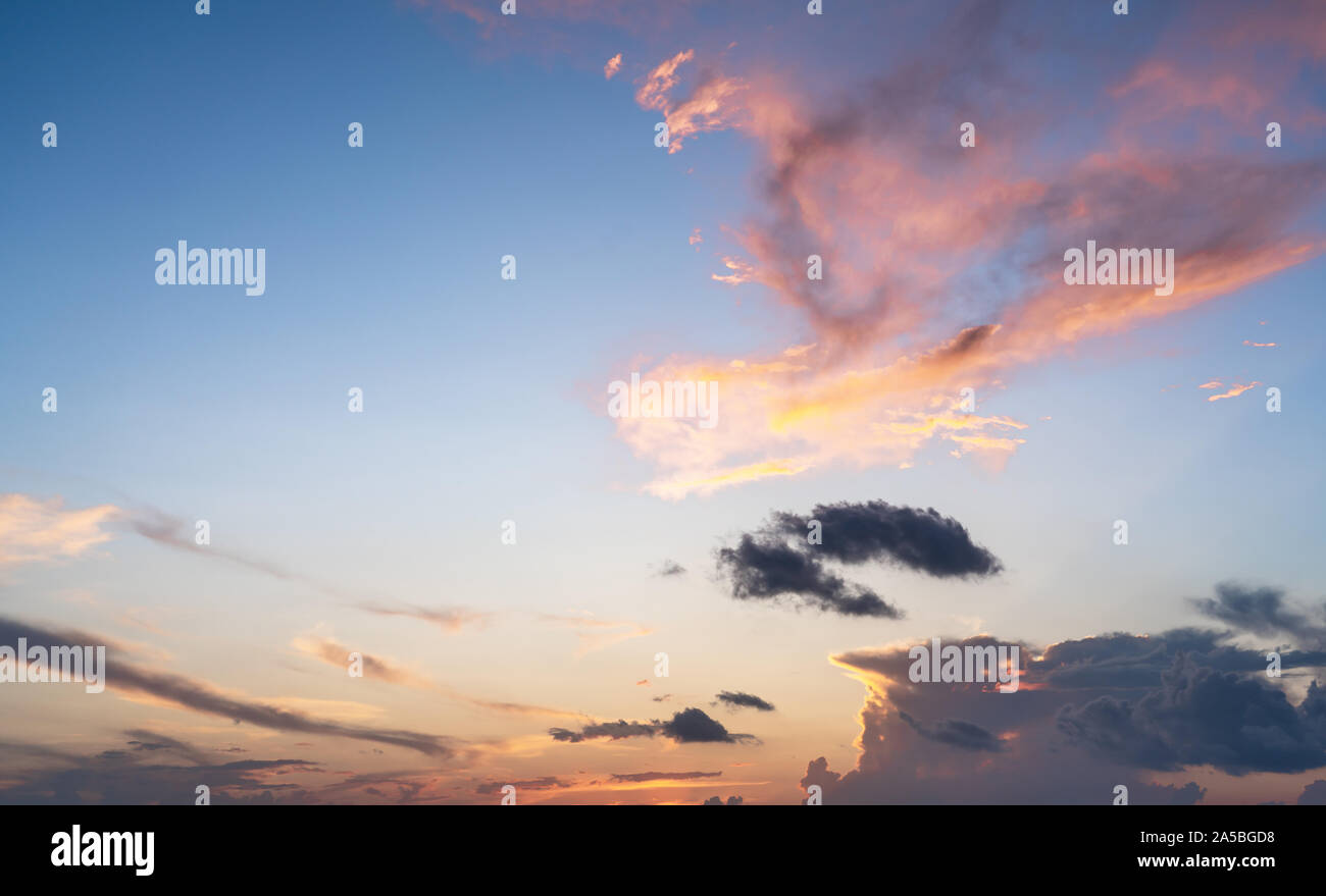 Colorful clouds on sunset sky, nature background Stock Photo - Alamy