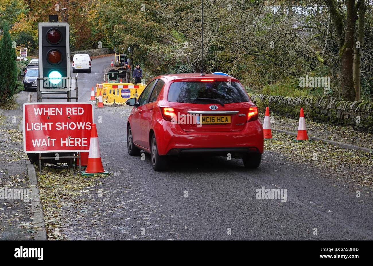 A car passes a green light on temporary traffic lights on Bridge Street ...